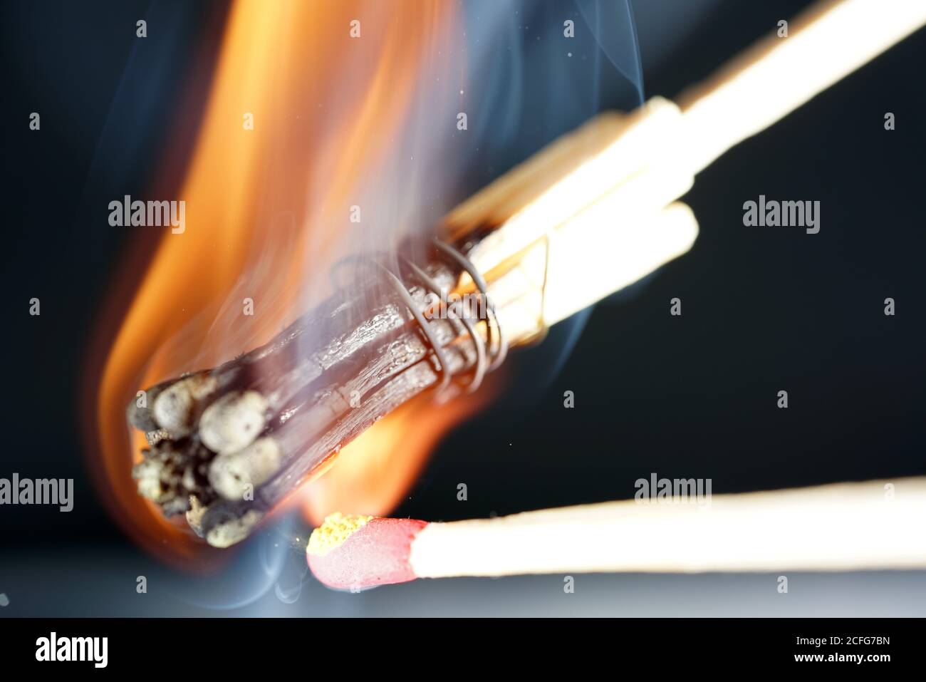 Lit matches and blown out in the studio photographed with colorful ...