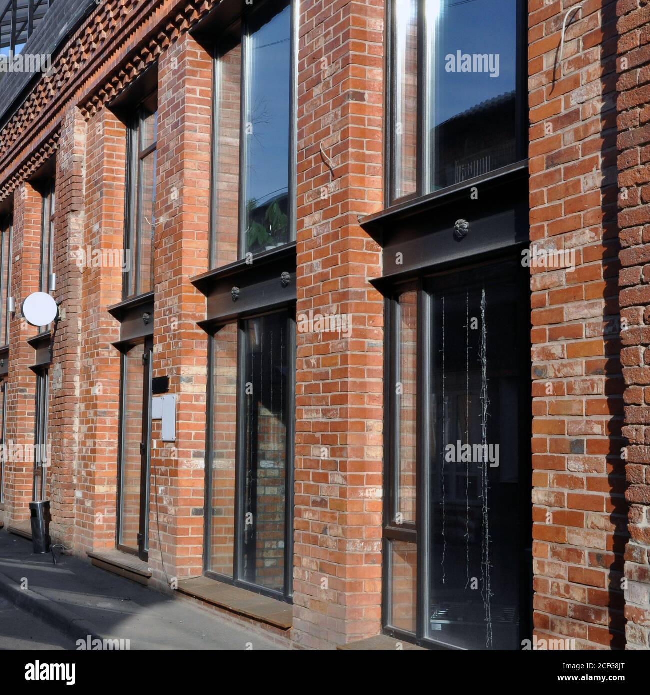 Exterior of a red brick building with a flat roof and high panoramic ...
