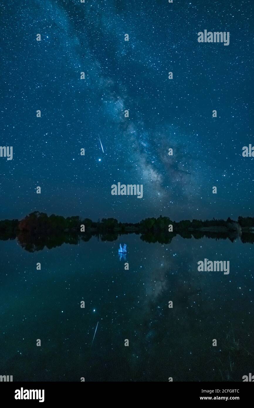 USA, Oregon, High Desert, Bend, Milky way and shooting star over local ...