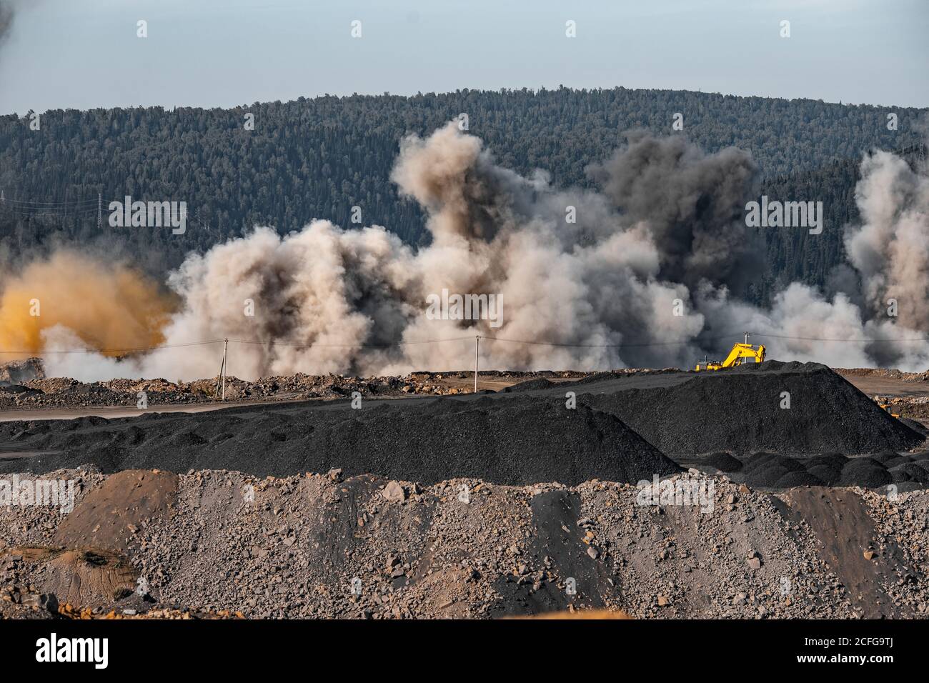 Explosive works on open pit coal mine industry Stock Photo - Alamy