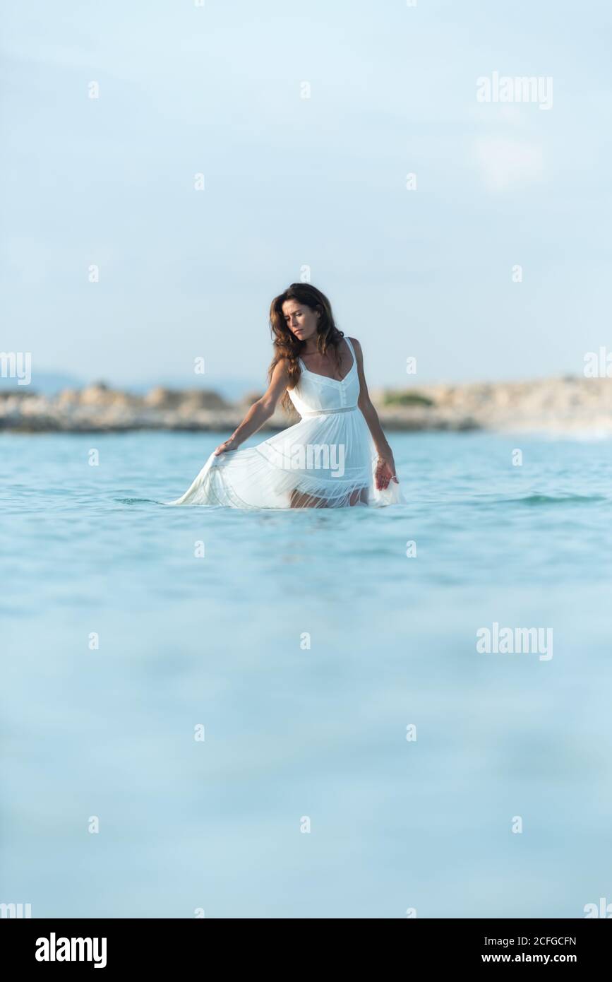 Woman in wet dress standing hi-res stock photography and images - Alamy