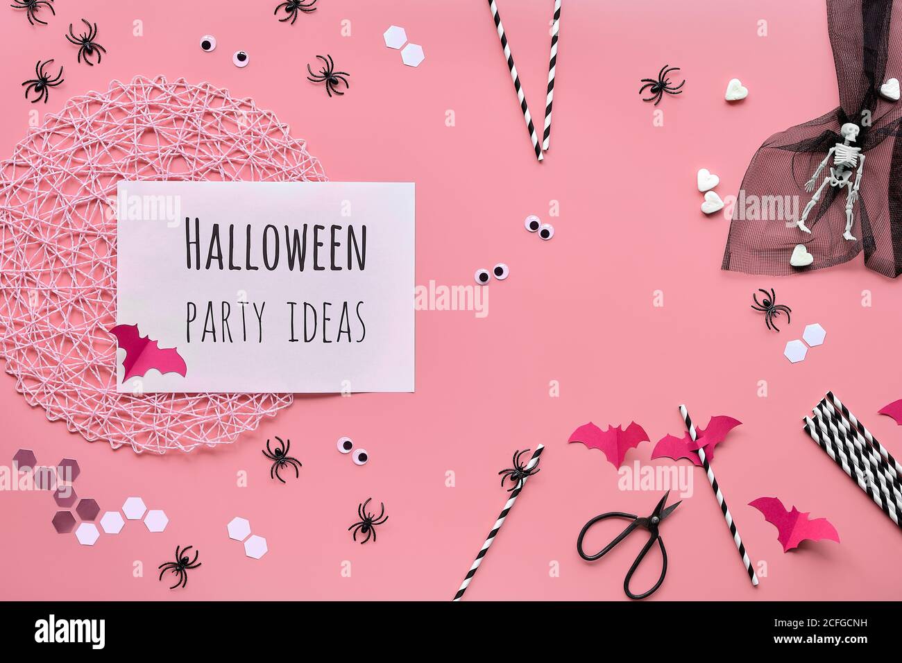 Halloween party ideas text on white page. Flat lay with scissors and ...