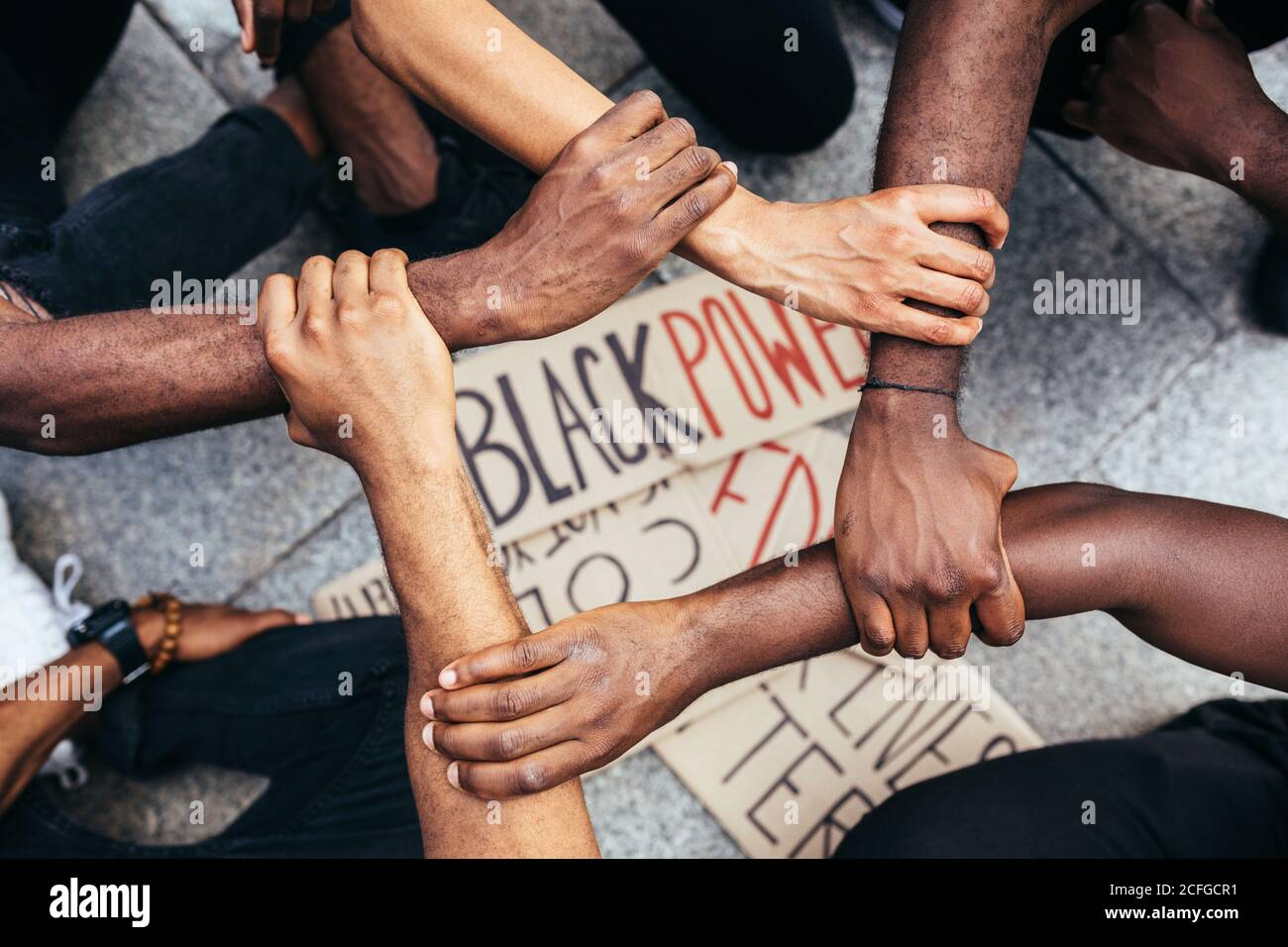 anonymous black people holding arms as a gesture against racism Stock ...