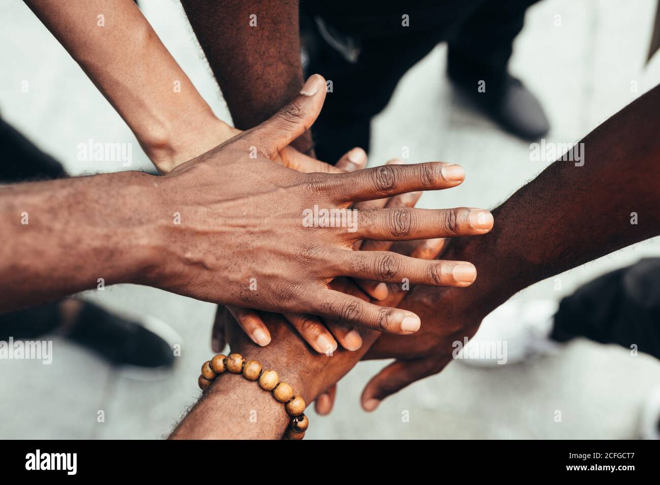 Group of friends stacking hands against racism. Black Lives Matters ...