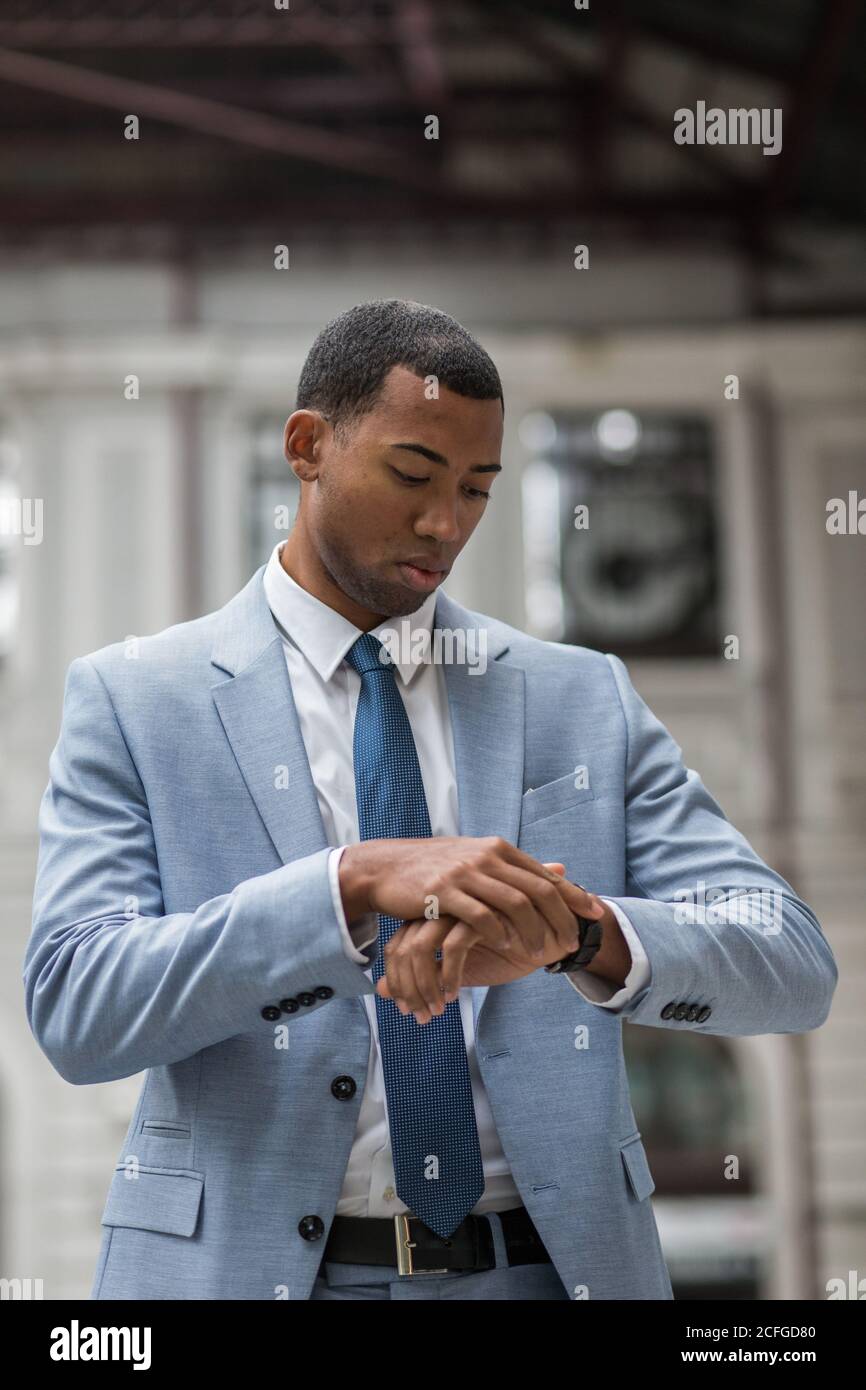 Man looking at watch outside hi-res stock photography and images - Alamy