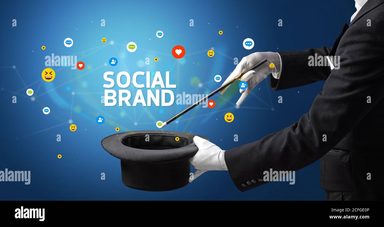 Magician is showing magic trick with SOCIAL BRAND inscription, social ...