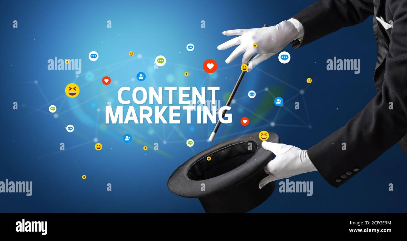 Magician is showing magic trick with CONTENT MARKETING inscription ...