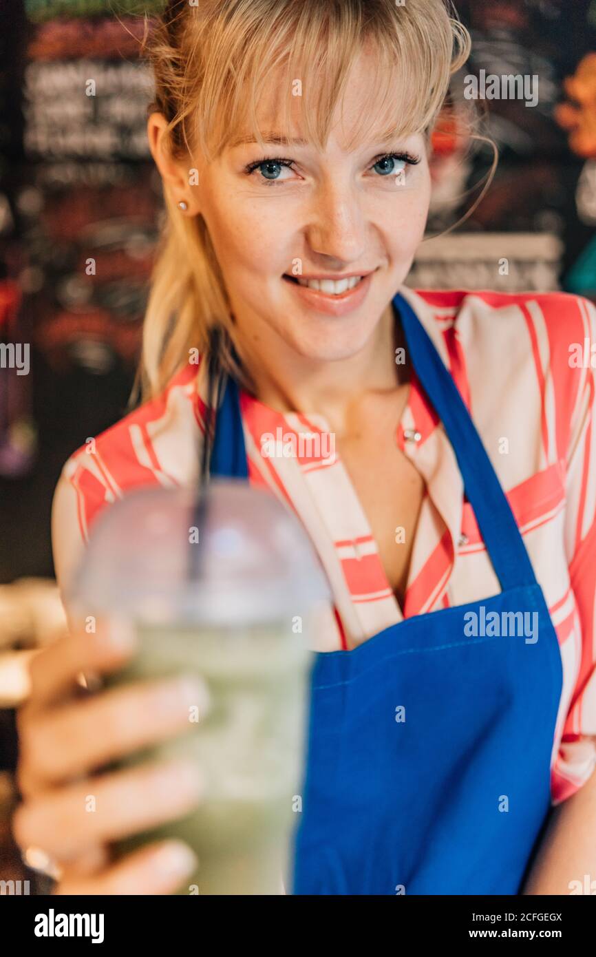 Handing drink hi-res stock photography and images - Alamy