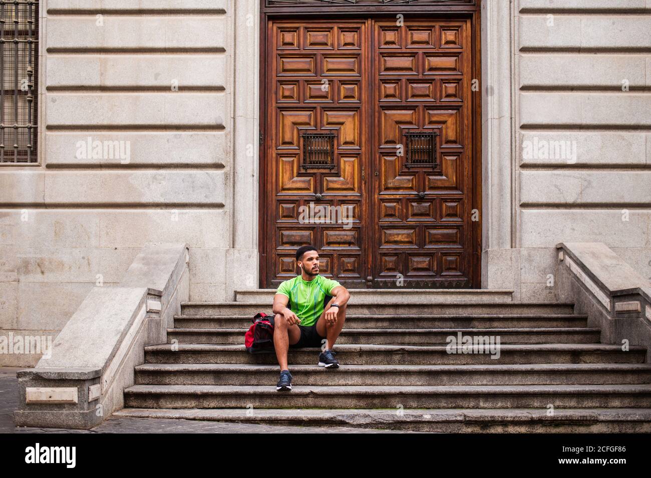 Man sitting stairs hi-res stock photography and images - Alamy