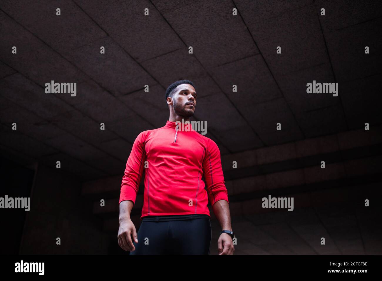 Young man standing around the city wearing sportswear Stock Photo - Alamy