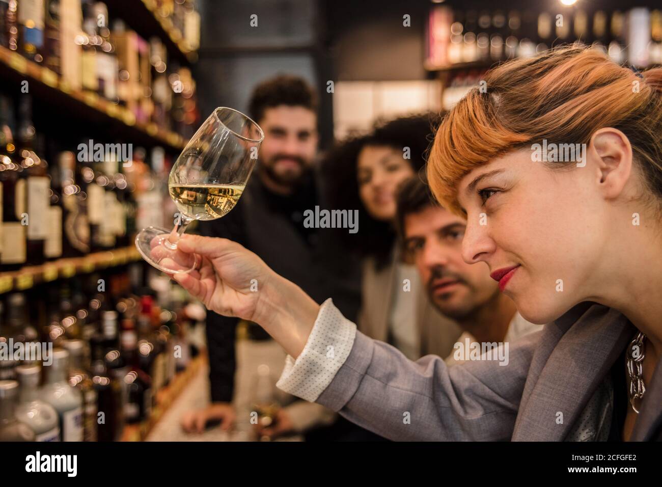 Group of people gathering in market wine house for tasting wine sorts ...