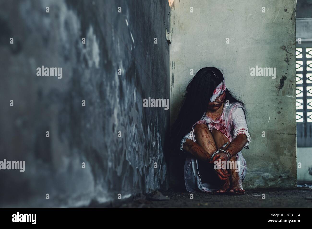 horror scence of women hands tied by rope. Ghost women wear white dress ...