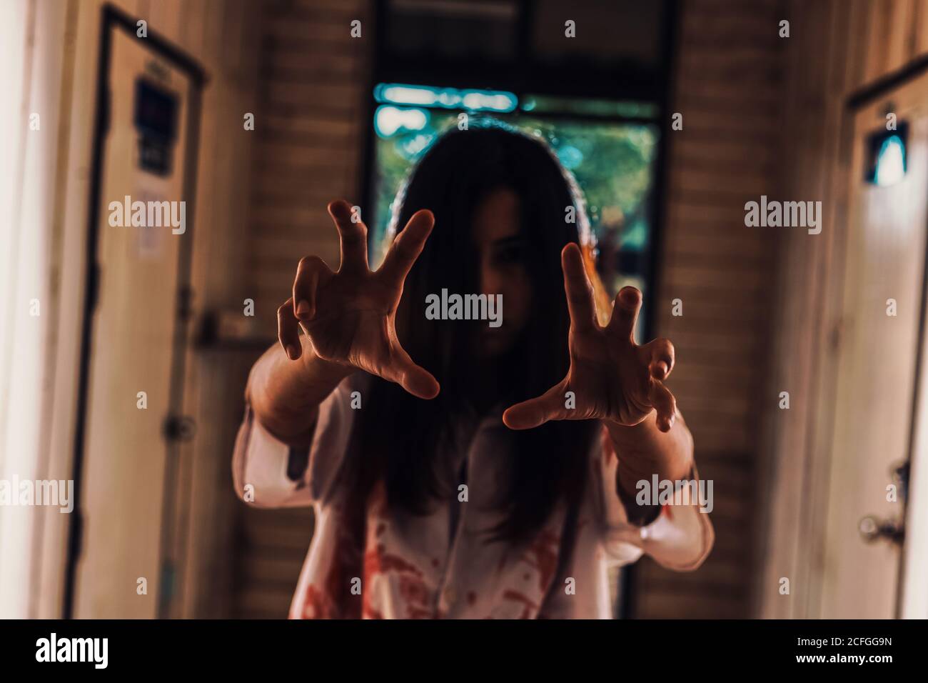 Halloween girl with scary hand in Abandoned house Stock Photo - Alamy