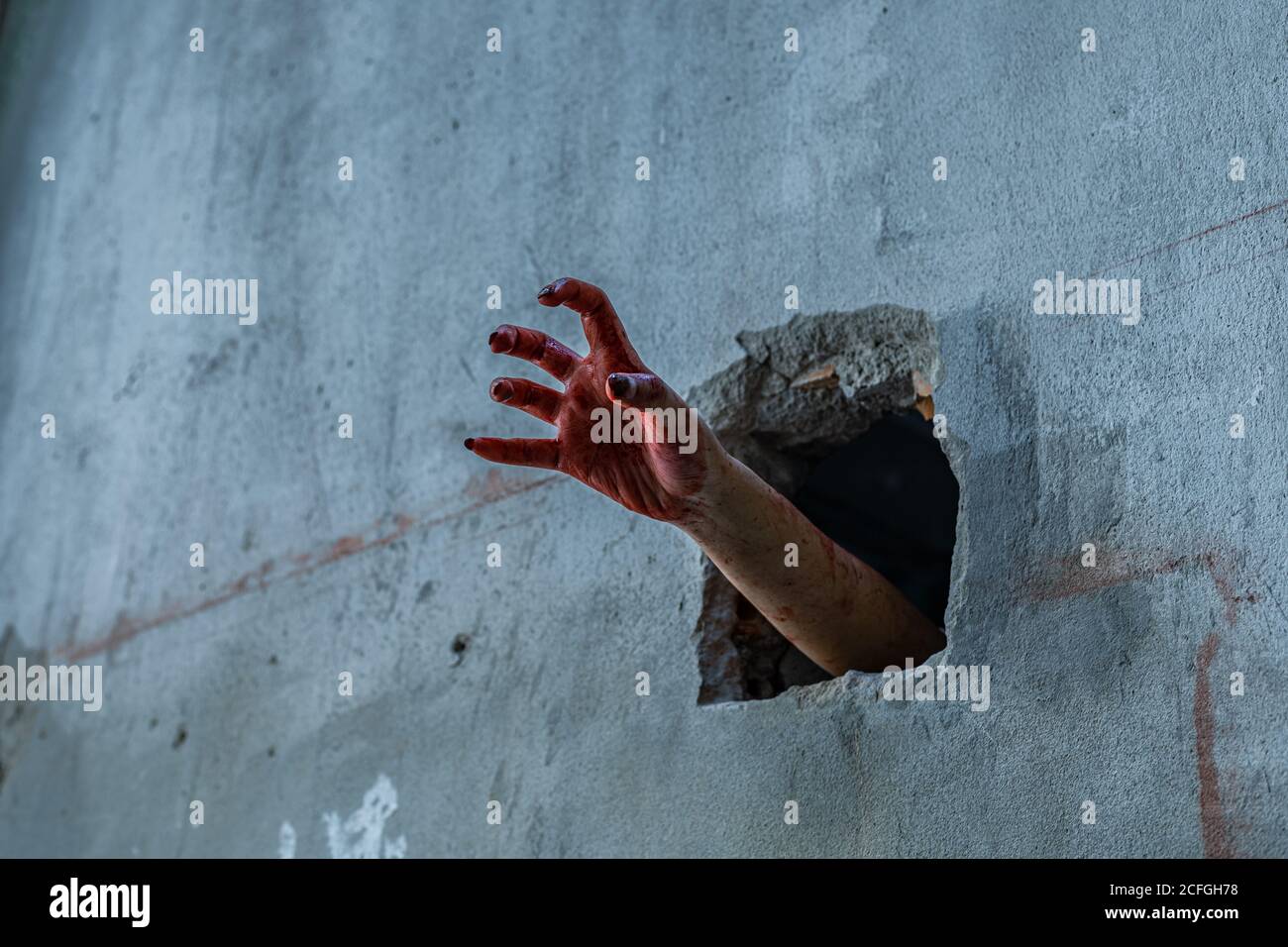 horror scence of woman with scary hand at abandoned house. hand through ...