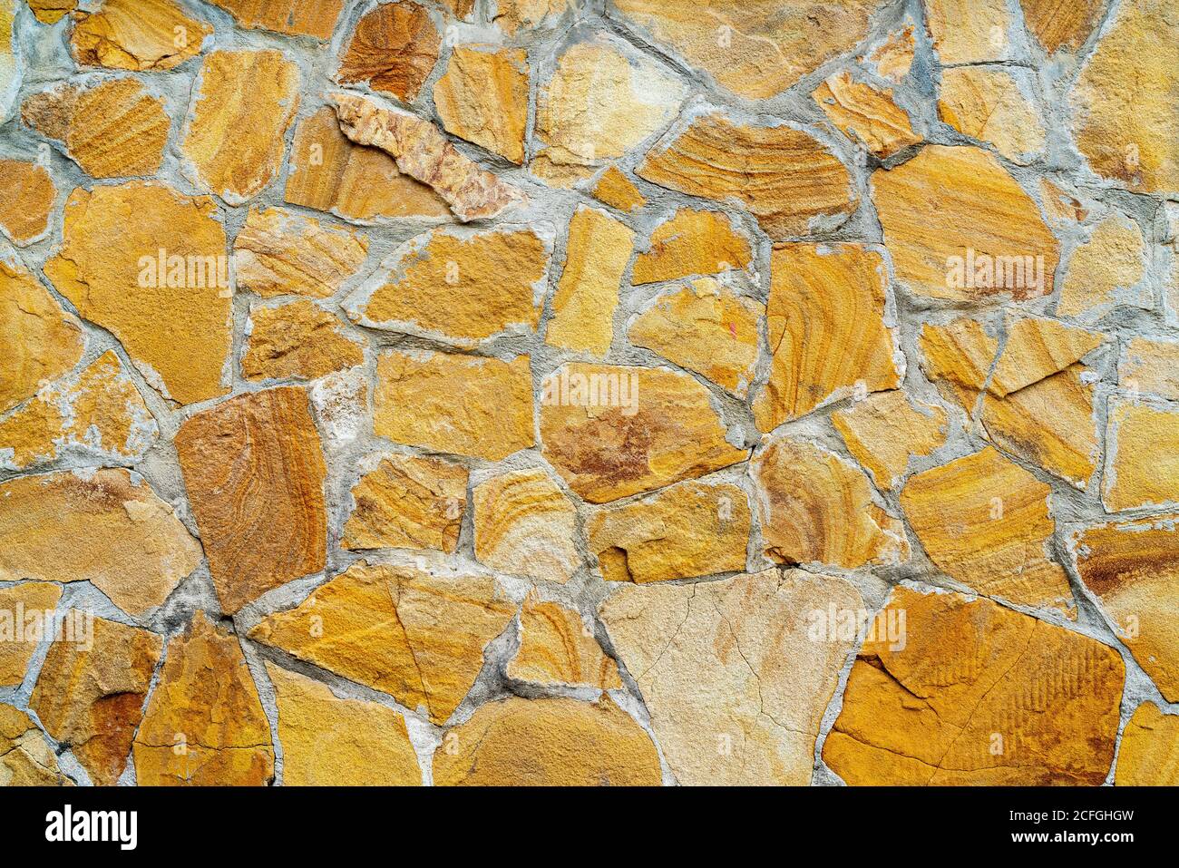 Yellow stone building wall. Interior of a modern loft. Background for ...