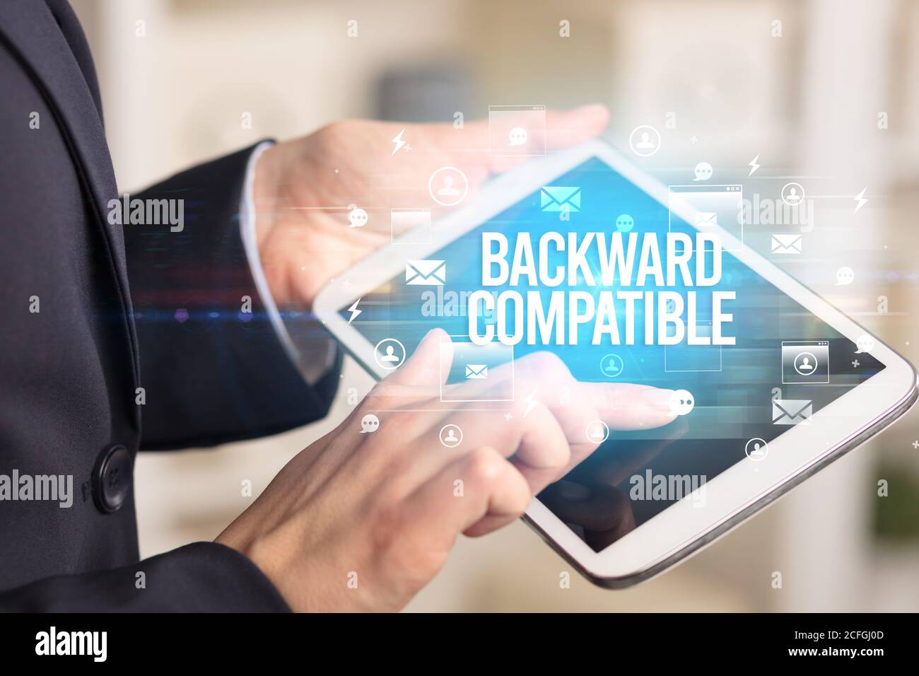 Close-up of a tablet searching BACKWARD COMPATIBLE inscription, modern ...