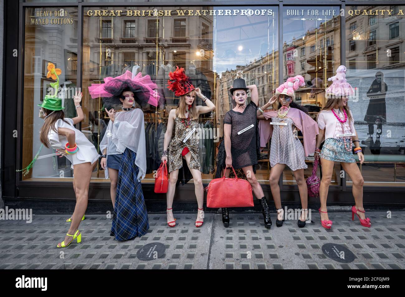 Models take part in a colourful flashmob street fashion show on Regent ...
