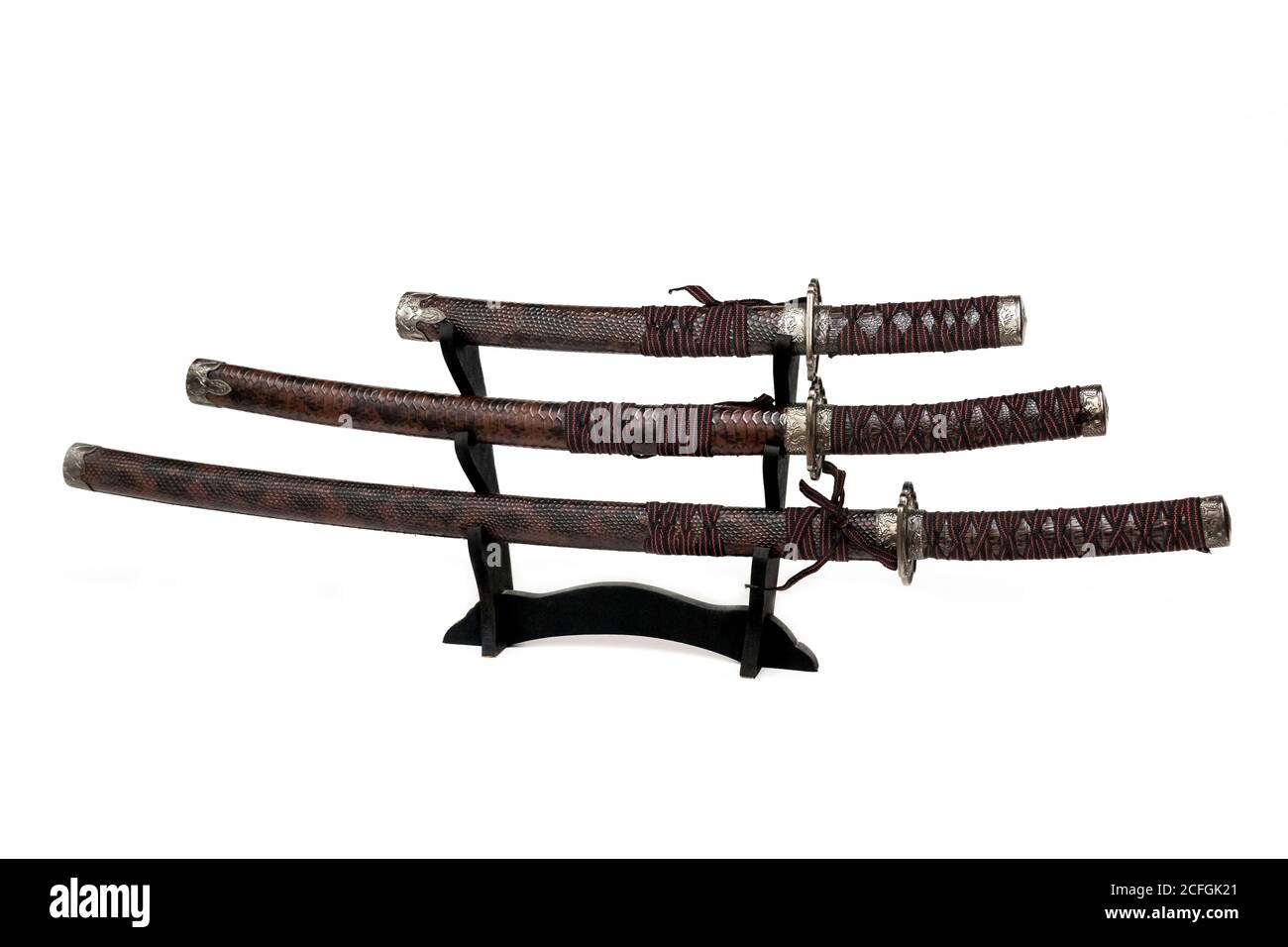 Three samurai swords on a stand on a white background Stock Photo - Alamy