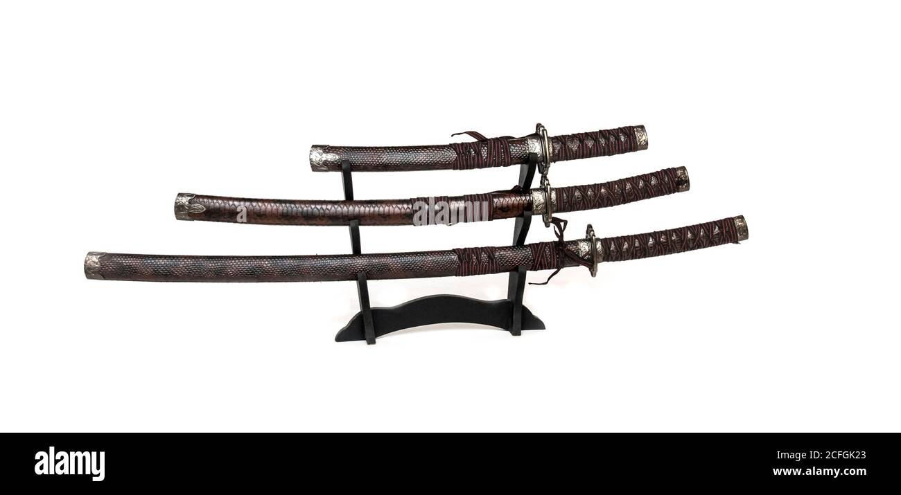 Three samurai swords on a stand on a white background Stock Photo - Alamy