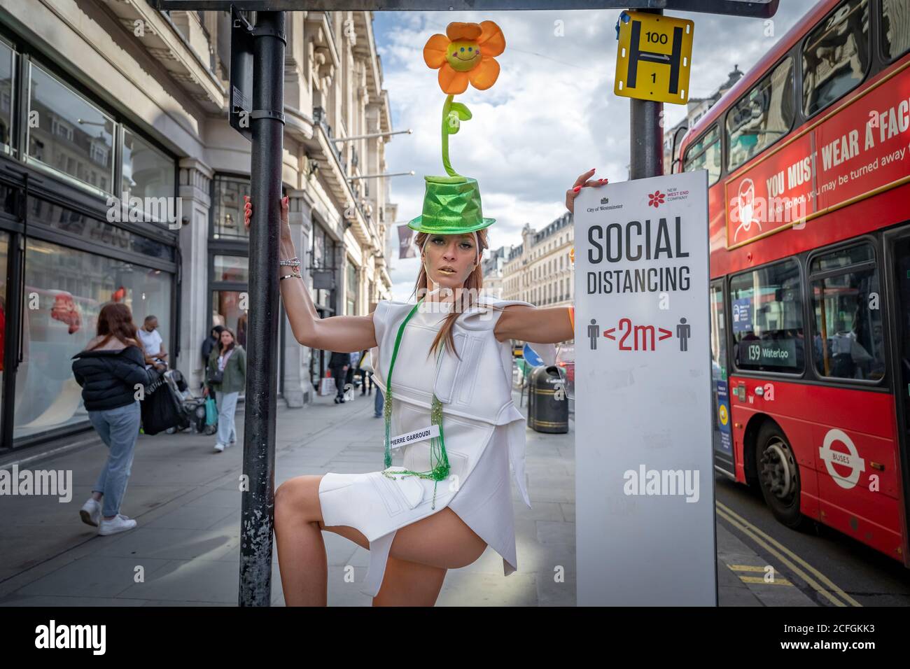 Models take part in a colourful flashmob street fashion show on Regent ...