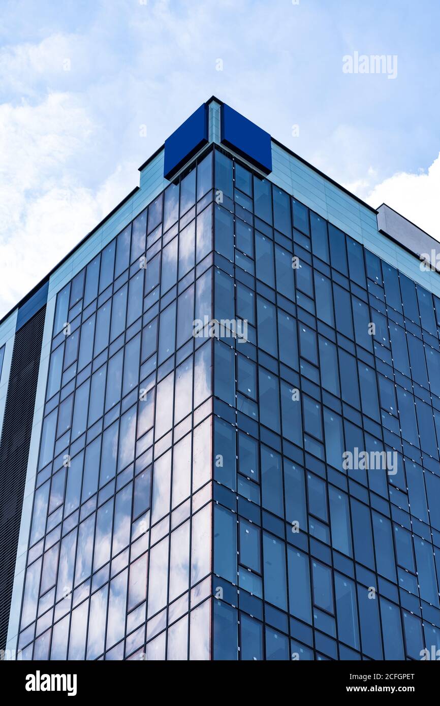 Modern Glass Building Architecture with blue sky and clouds Stock Photo ...