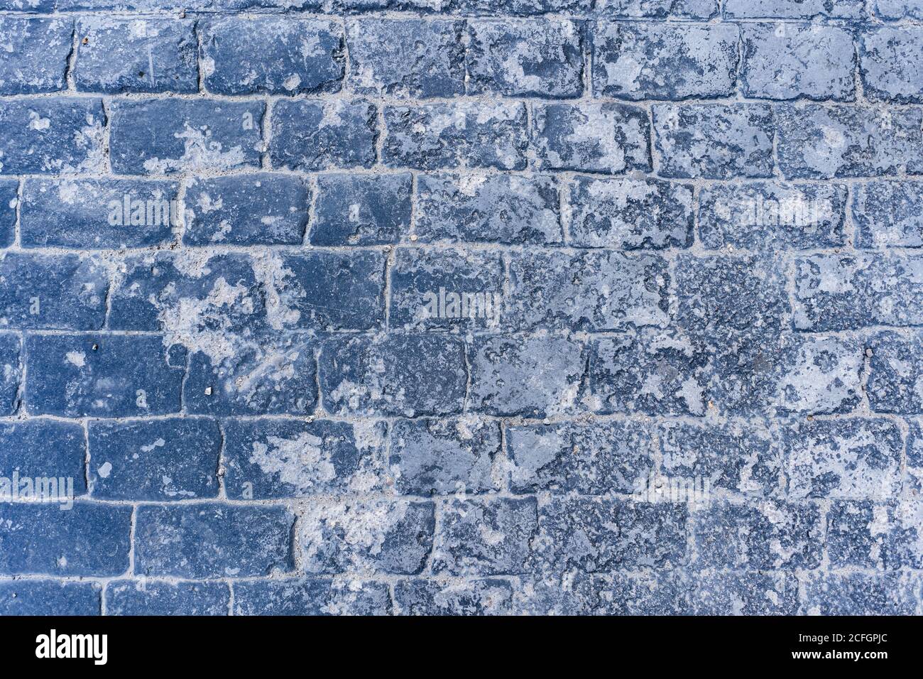 Cobblestone pavement road with edge courses at the sidewalk texture ...