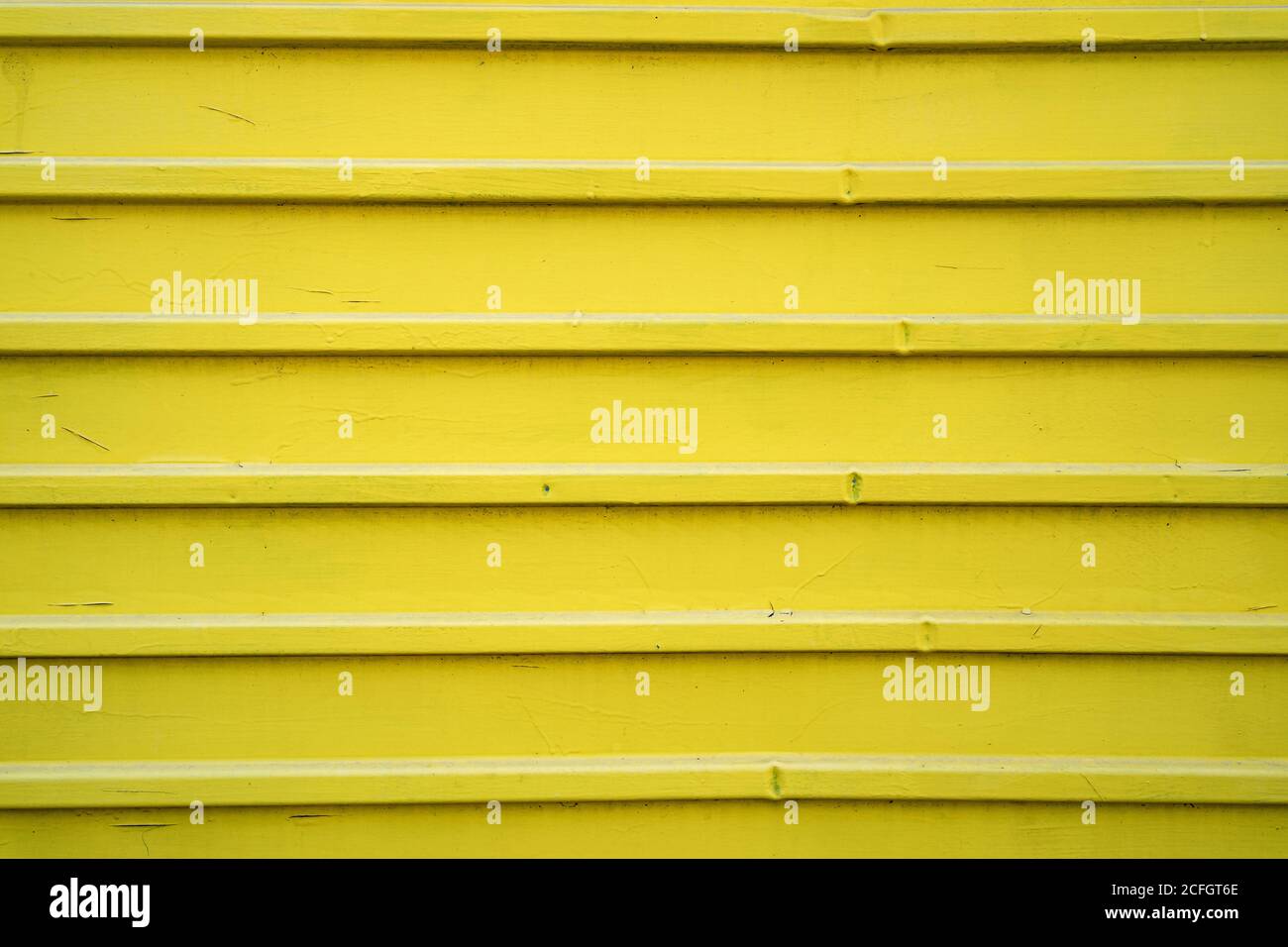 Yellow iron tin fence lined background. Metal texture Stock Photo - Alamy