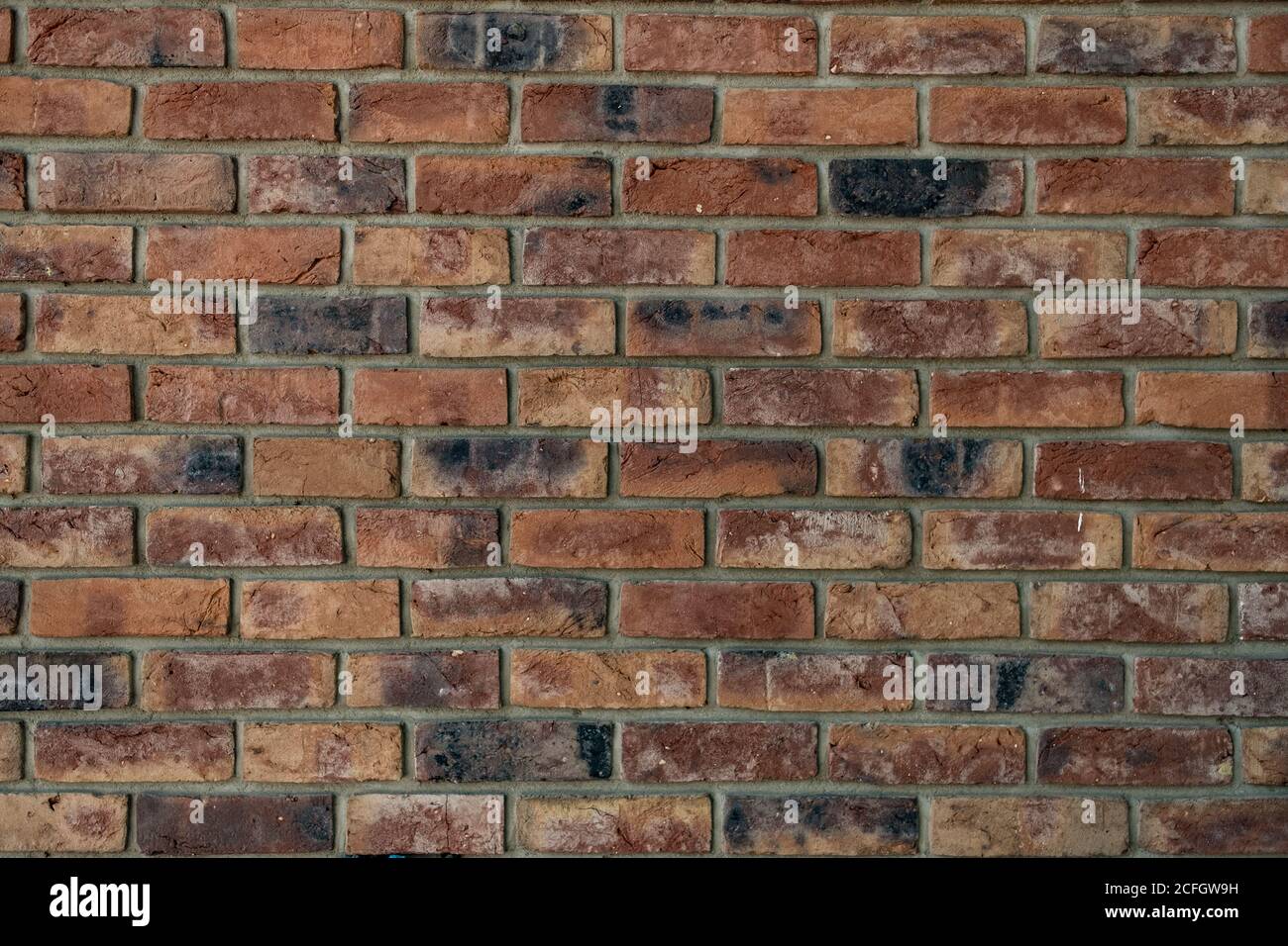 Brick wall. Texture of red brick with gray filling Stock Photo - Alamy