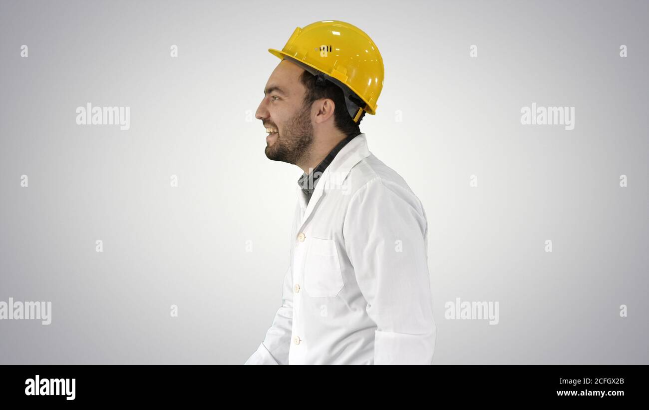 Construction engineer putting on yellow hi-res stock photography and ...