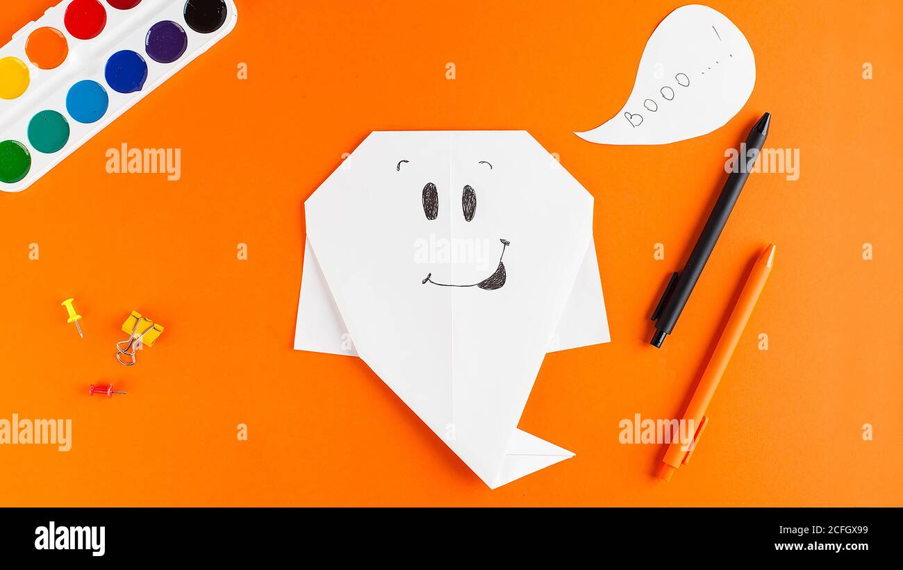 Paper Ghost banner on an orange background. The concept of Halloween ...
