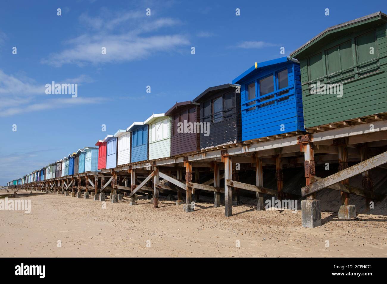 A row of colourful beach huts at Frinton-on-Sea, Essex Stock Photo - Alamy