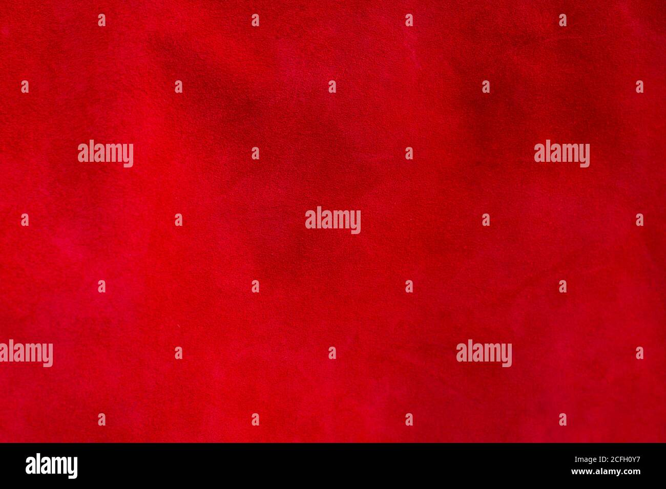 Red matte background of suede fabric, closeup. Velvet texture of ...