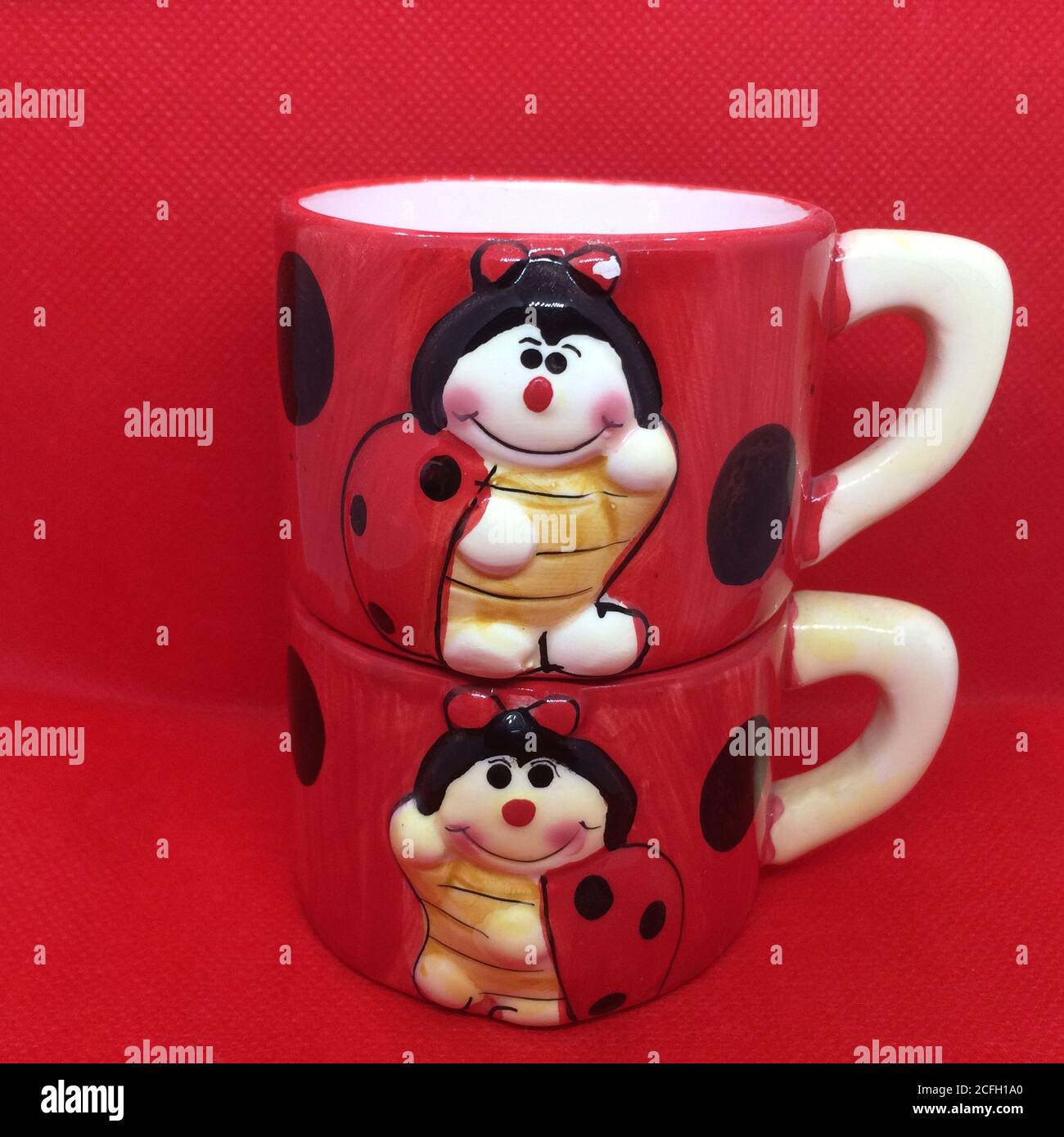 Ladybug Mugs, Stacked Cartoon Cups, Playful Kitchenware Stock Photo - Alamy