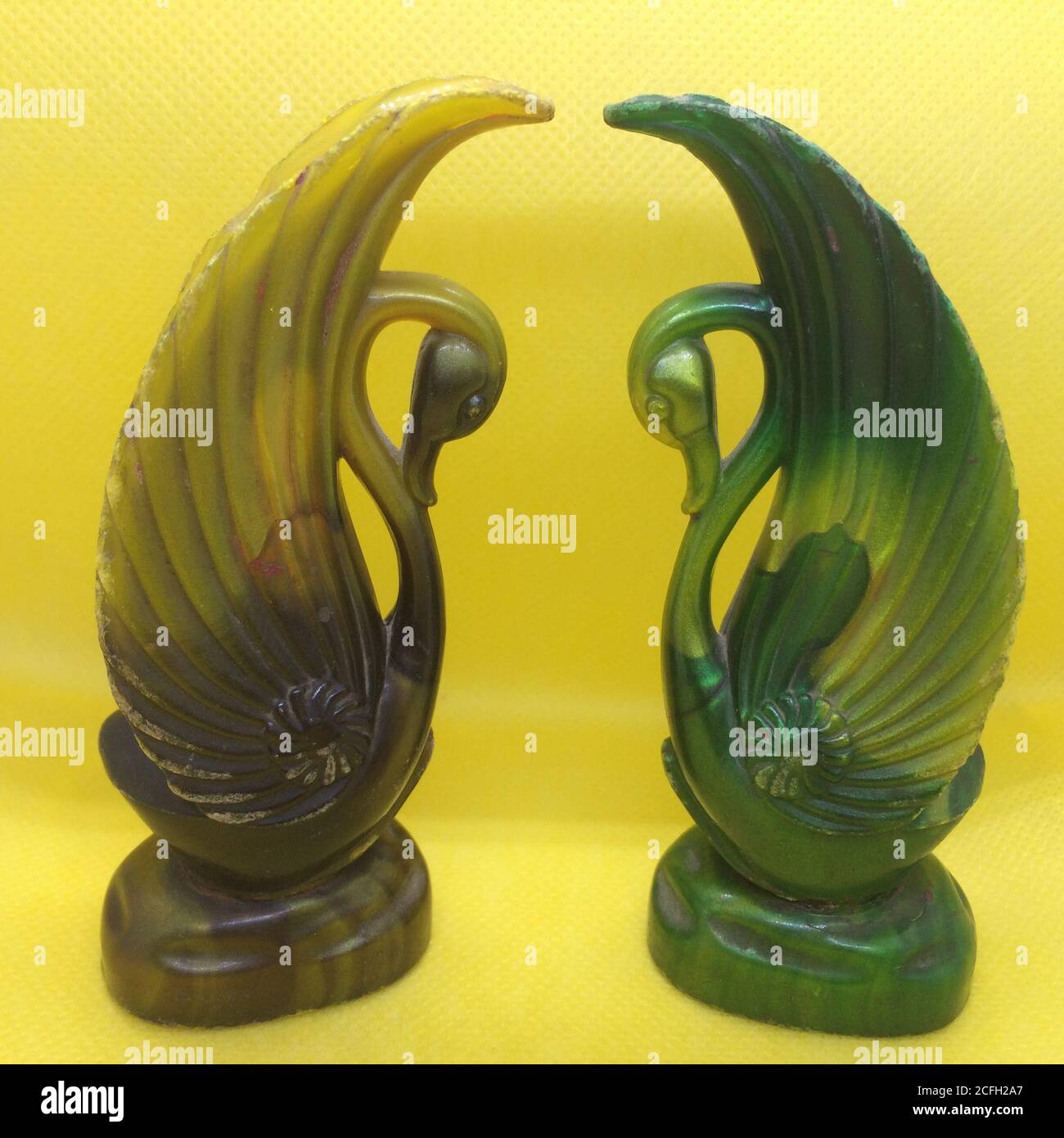Graceful Swan Sculptures, Dynamic Motion, Green and Brown Aesthetic on ...