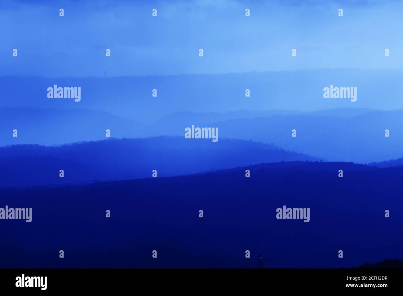 Mountains summer landscape with blue colors gradient of mountain peaks ...