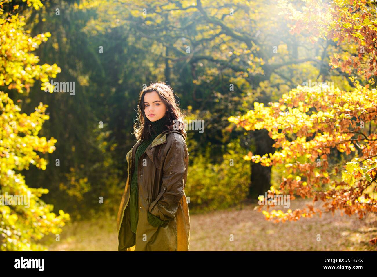 Teenage Girl Outdoors enjoying nature. Teenager posing over yellow ...