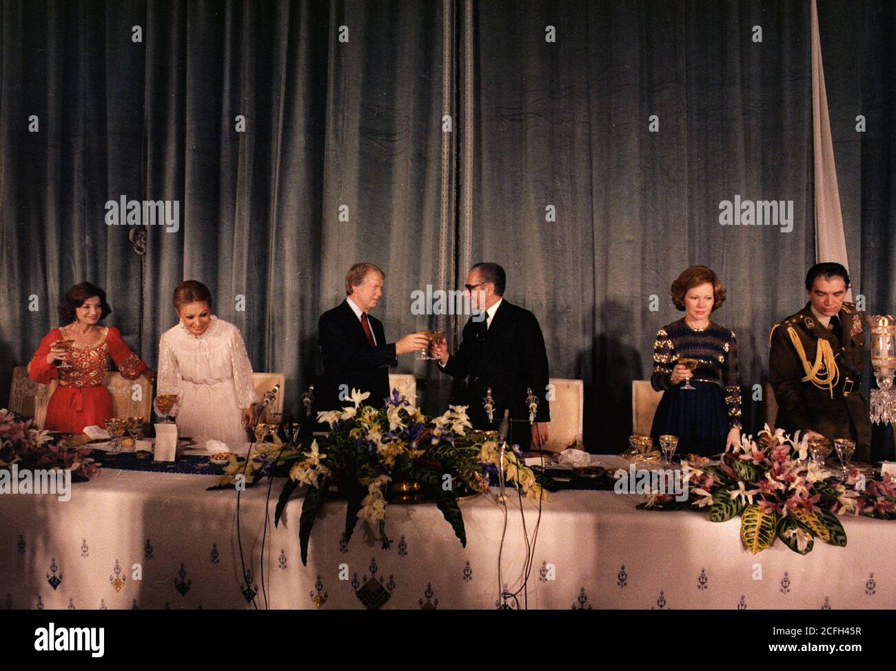 Jimmy Carter and the Shah toast at a State Dinner hosted by the Shah of ...