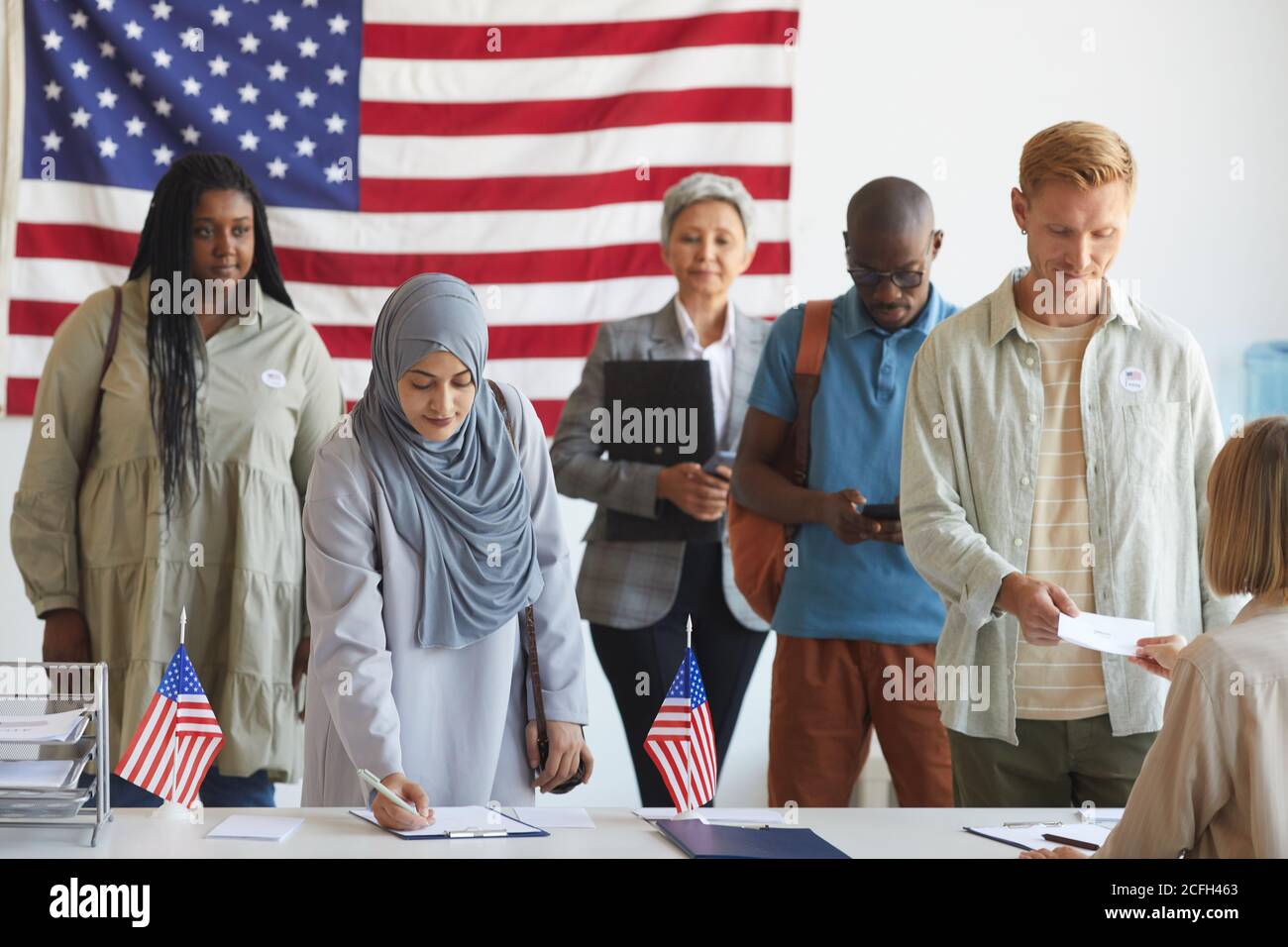 Diverse group of people american flag hi-res stock photography and ...