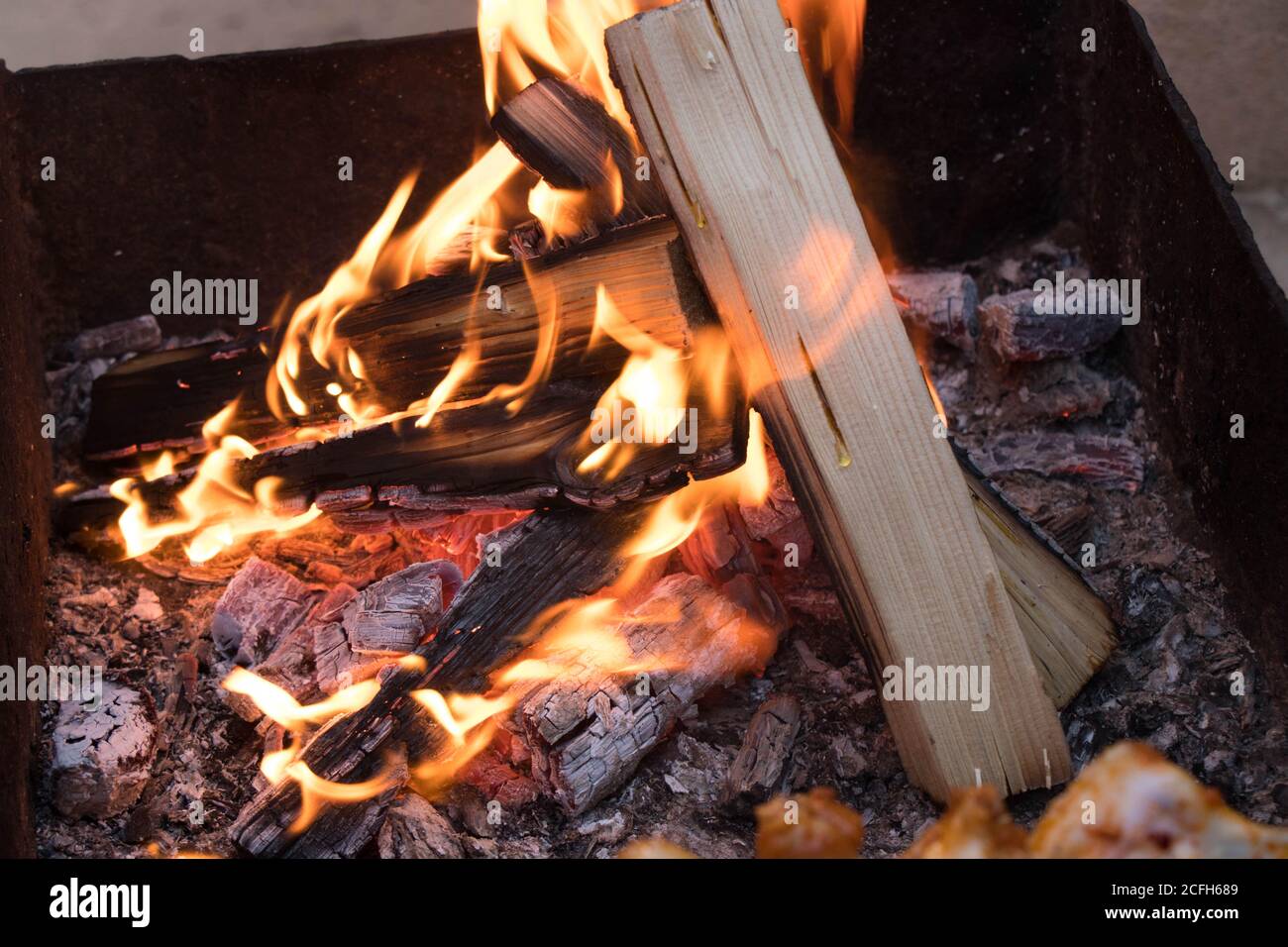 Small campfire with flames. Smoldering wood Stock Photo - Alamy