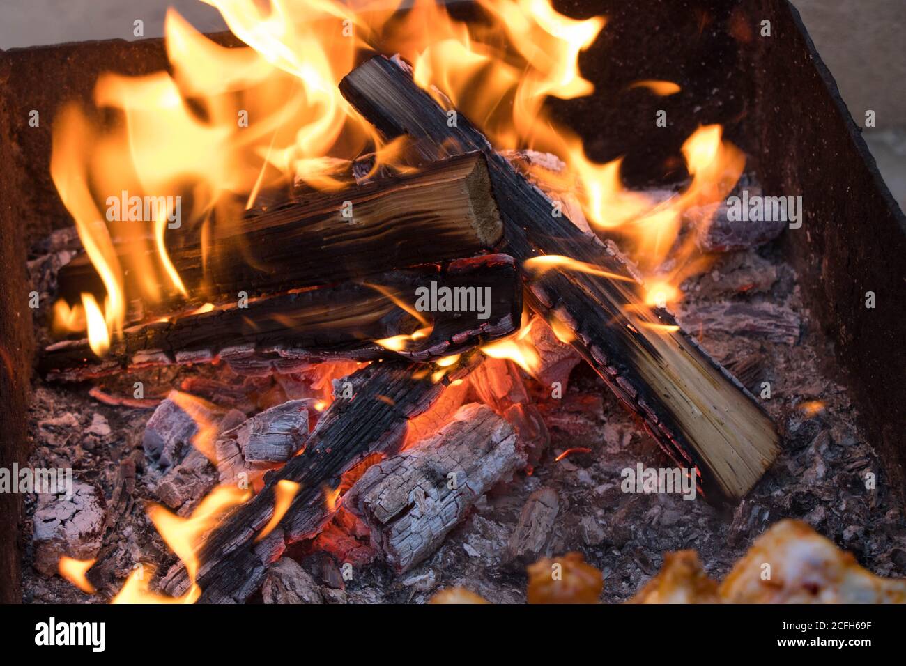 Small campfire with flames. Smoldering wood Stock Photo - Alamy