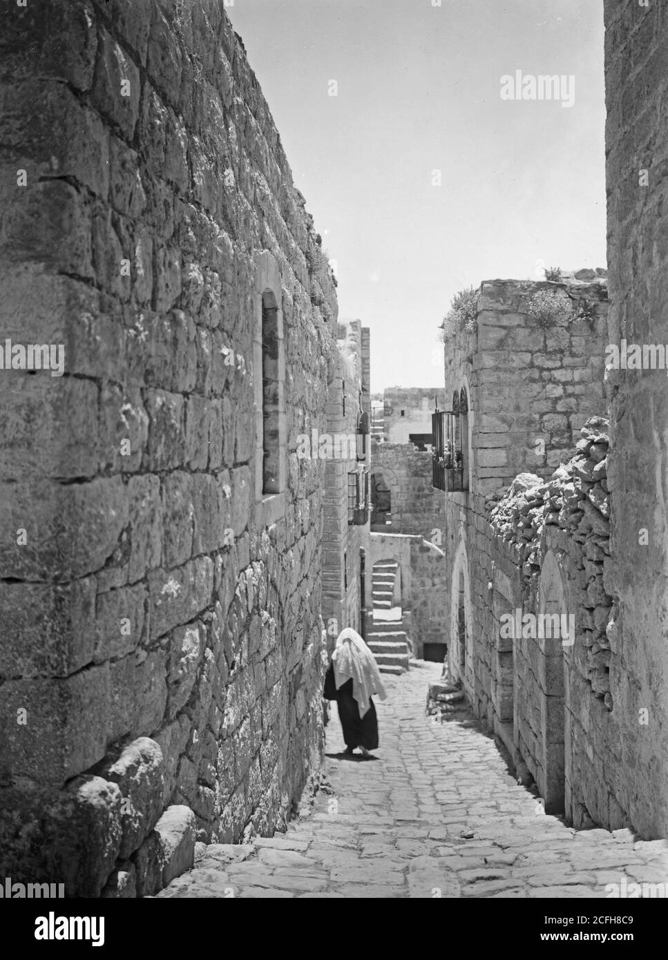 Woman walking down bethlehem street hi-res stock photography and images ...