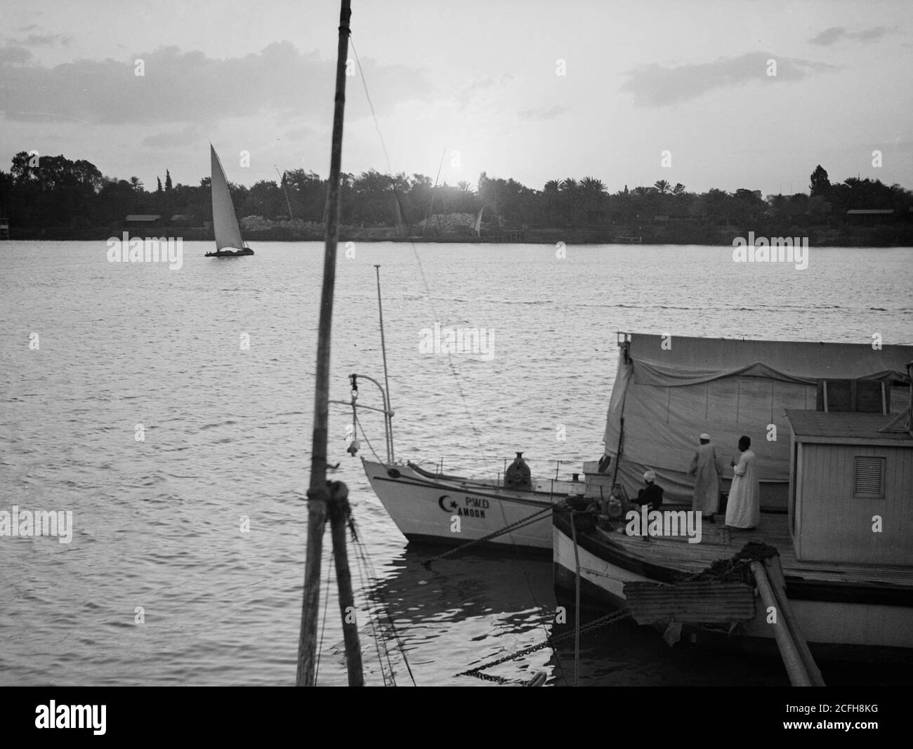 Original Caption: Egypt. River scenes. The Nile. Sunset scenes across ...