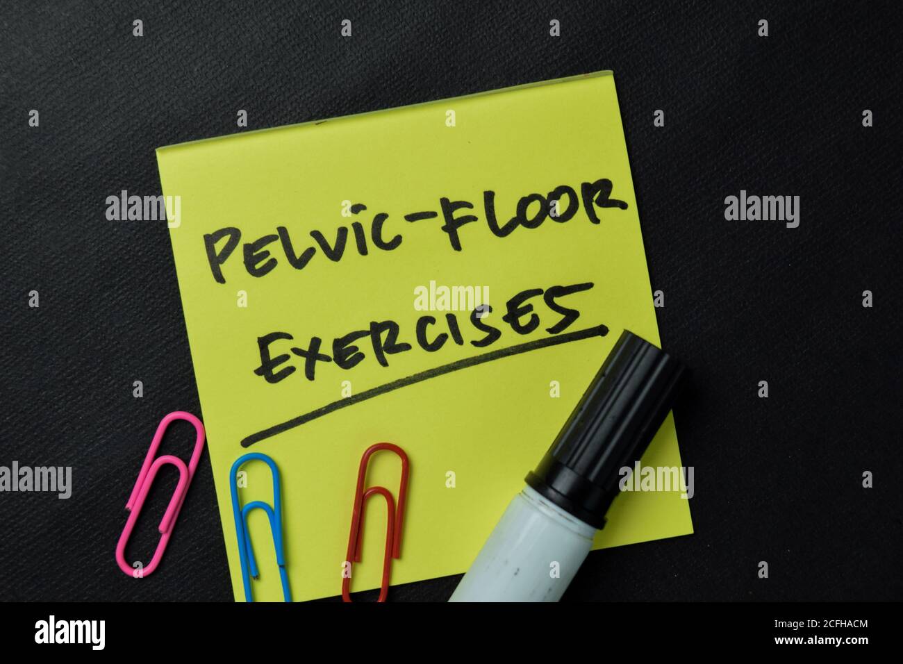 Pelvic-Floor Exercises write on sticky notes isolated on office desk ...