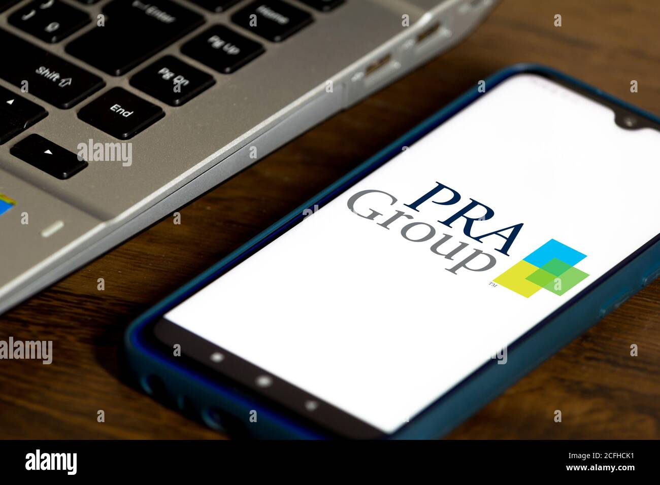 In this photo illustration the PRA Group logo seen displayed on a ...