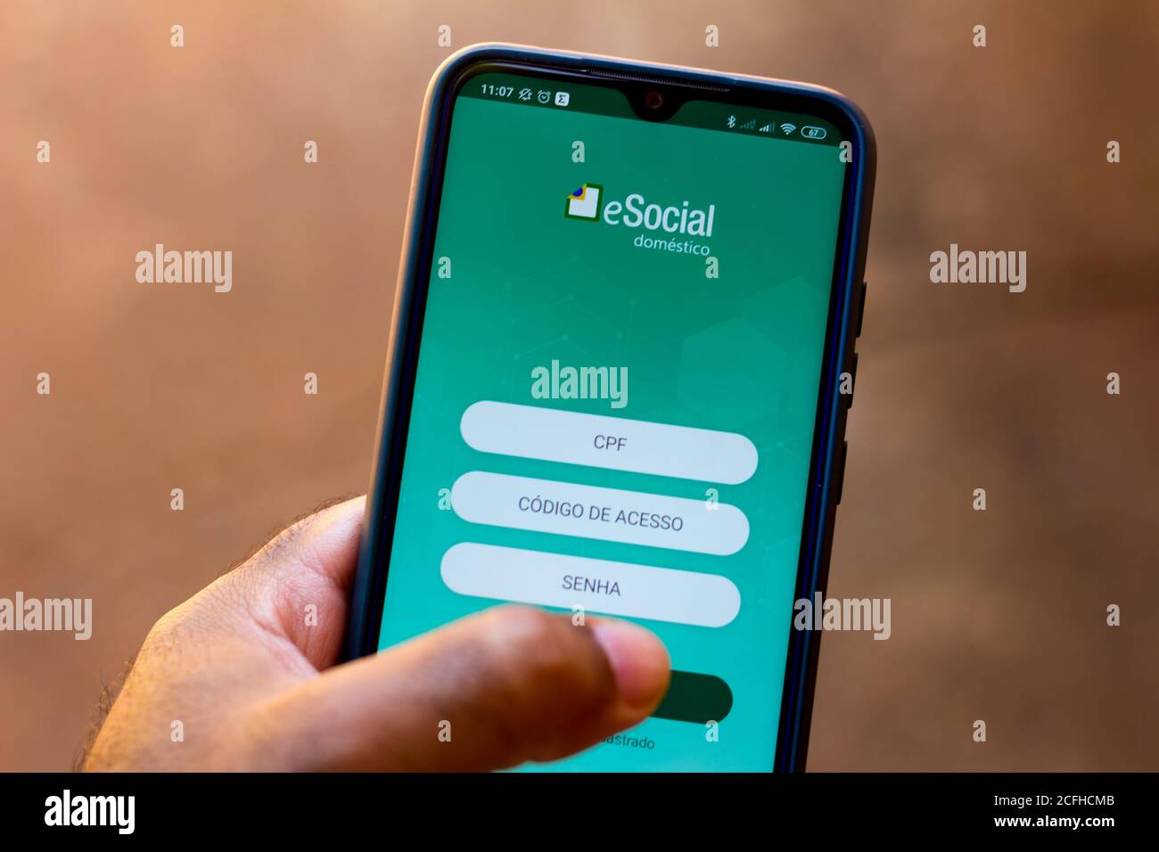 In this photo illustration the eSocial logo seen displayed on a smartphone Stock Photo - Alamy