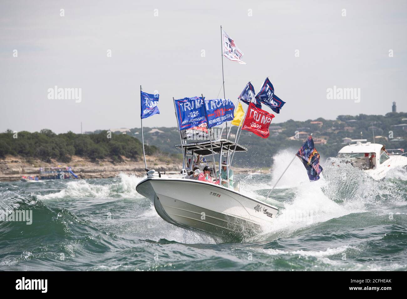 Lakeway, Texas USA Sept. 5, 2020: Boater flying Trump flags cuts ...