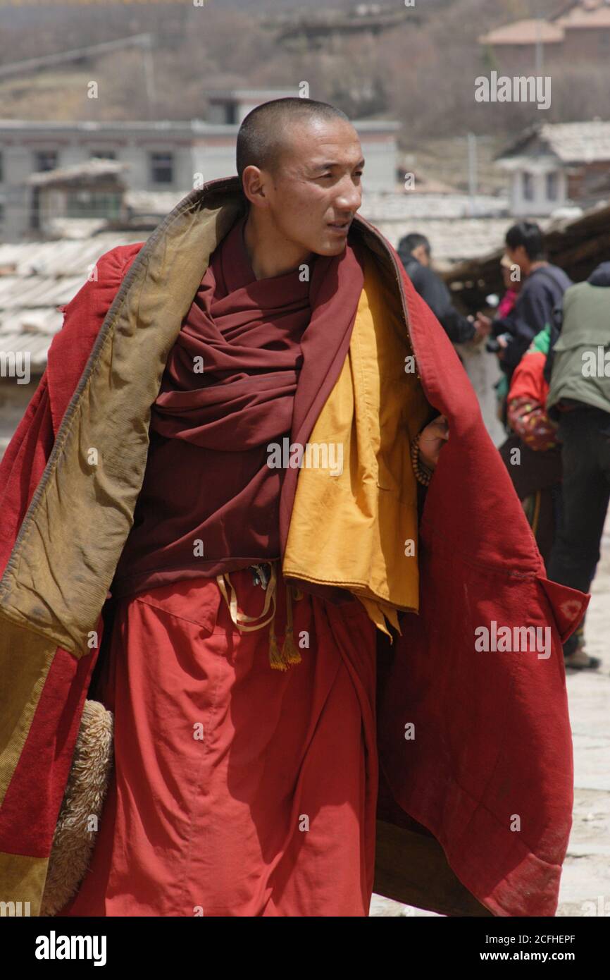 Vertical portrait of a Gelugpa, or Yellow Hat Order Monk, at Langmusi ...