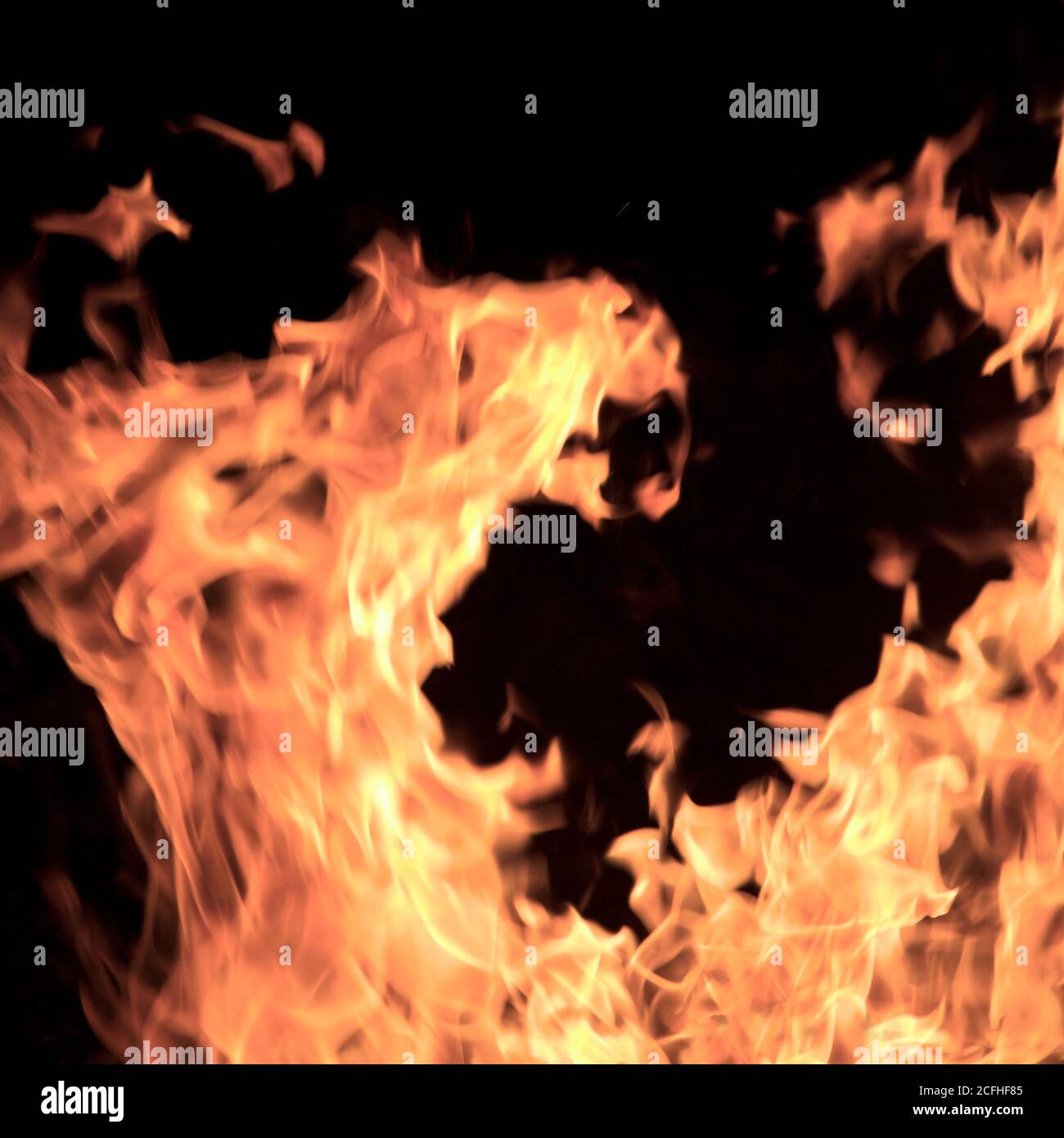 red flame tip on the black background Stock Photo - Alamy