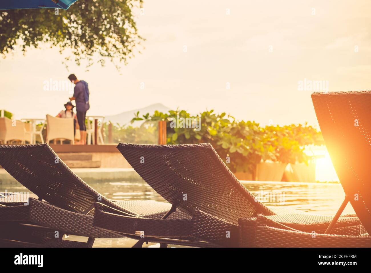 Beautiful luxury hotel swimming pool with sunset scene background Stock ...