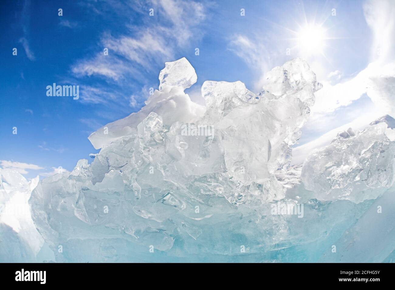 Ice on blue sky background Stock Photo - Alamy